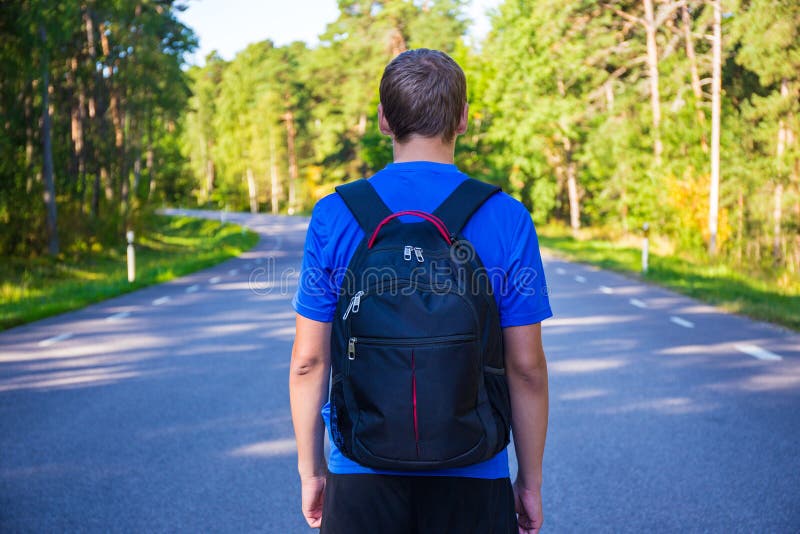 Hiking Concept - Back View of Man Walking on Forest Road Stock Image ...