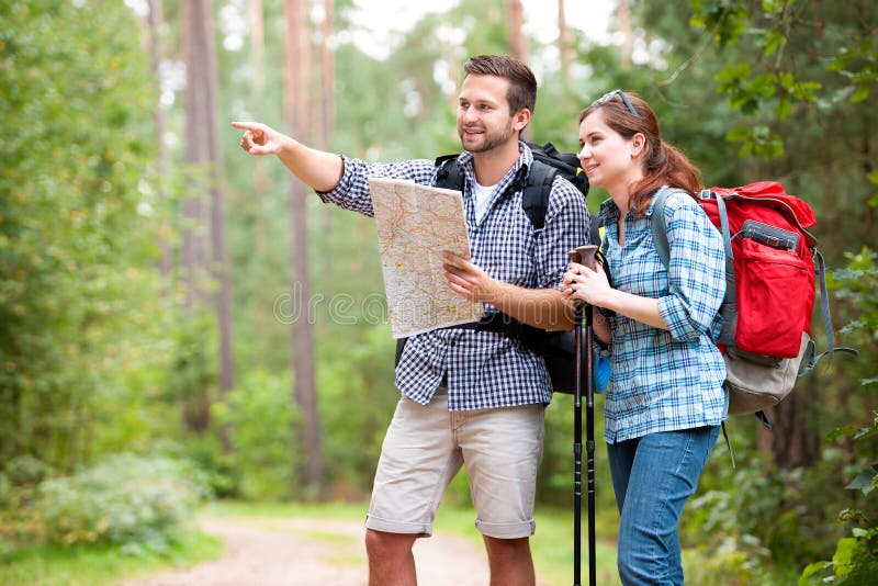 Hiking couple stock image. Image of backpack, sticks - 43776287