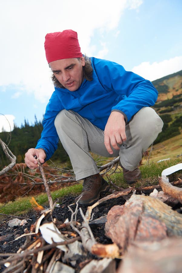 Hiking Man Try To Light Fire Stock Image - Image of campfire, hiking ...
