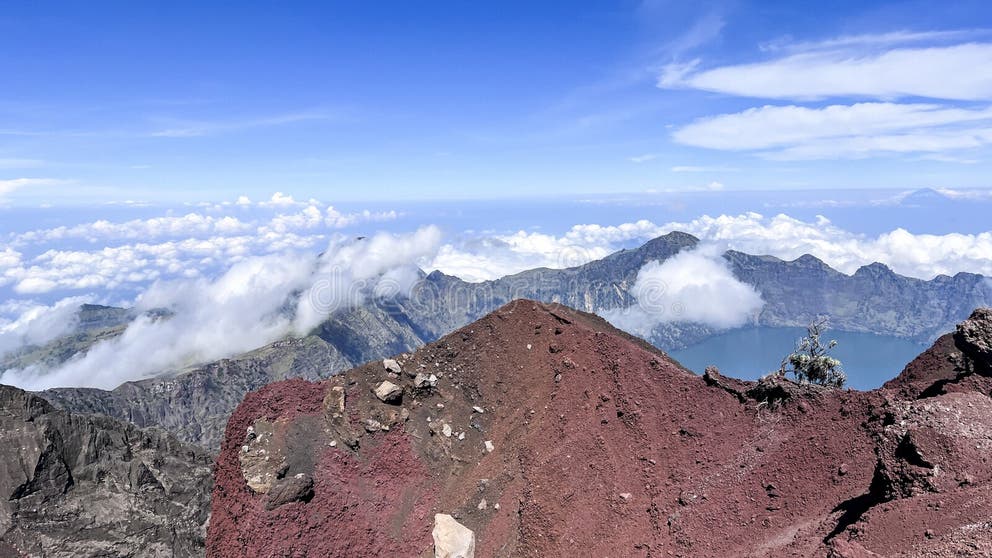 Hiking Mountain Trail among Rocks and Plants with a View of the Clouds ...