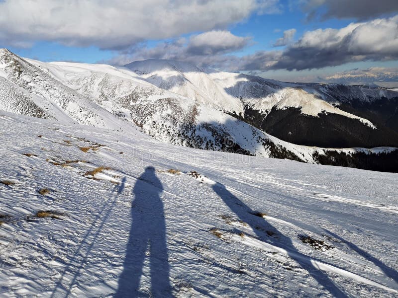 Climbing Mountains - Climbers Shadow in the Mountains Stock Photo ...