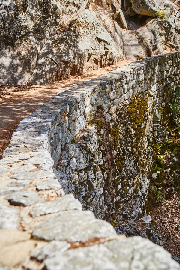Hiking Path Featuring Giant Stone Wall Along Cliffs Stock Photo - Image ...