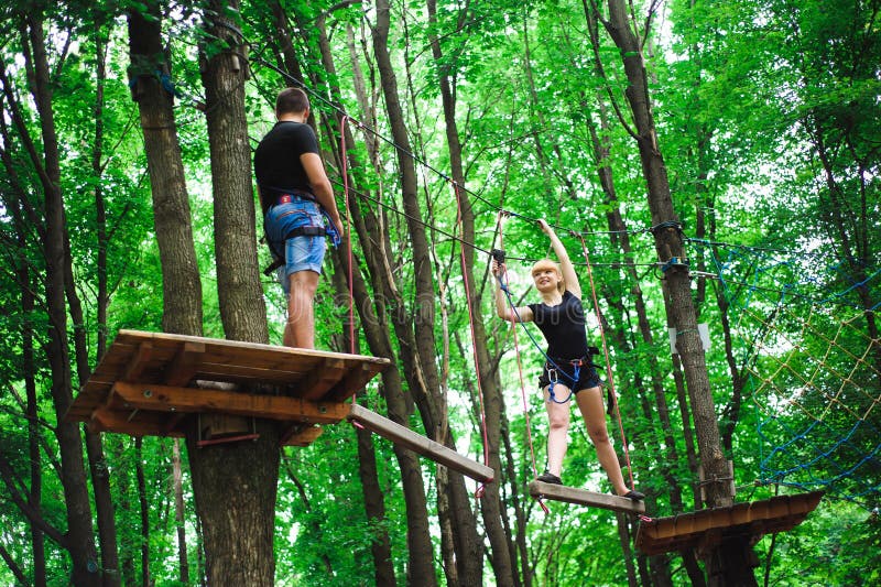 Hiking in the Rope Park Two Young People. Stock Image - Image of ...