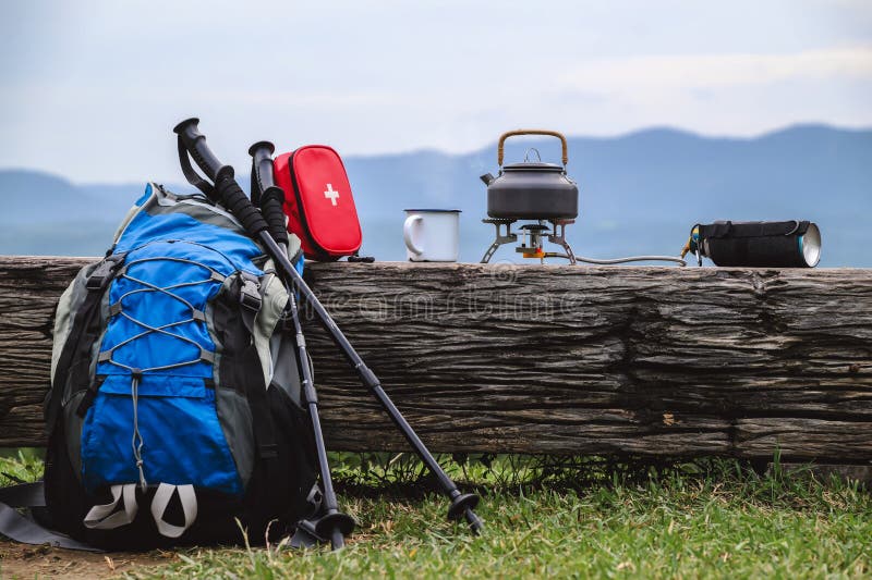 A Hiking Setup Includes a Backpack, Trekking Poles, a First Aid Kit, a ...
