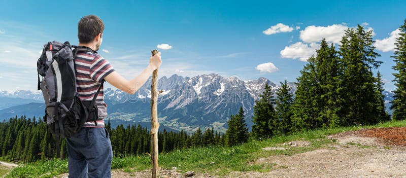 Hiking Tourist with Backpack from Behind. Alps in Background. Stock ...
