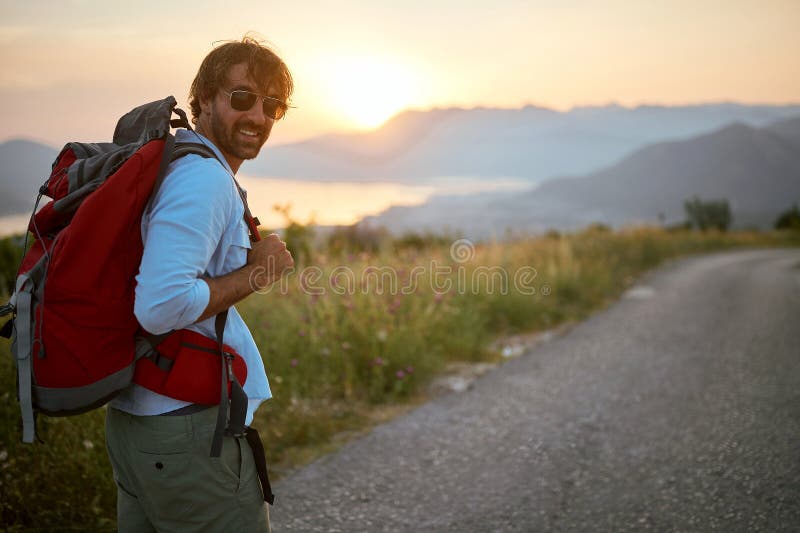Hiking. Young Man with Backpacks at Evening Stock Photo - Image of ...