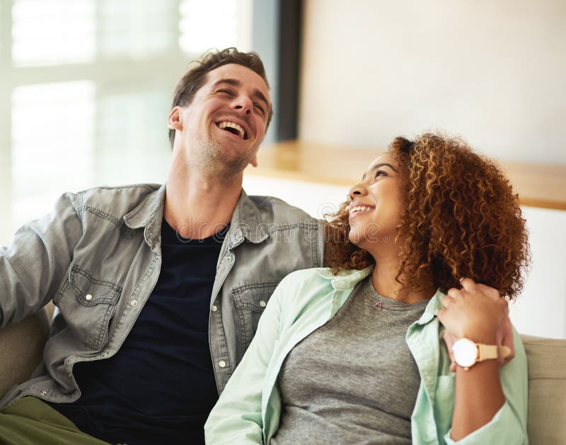 That Is Hilarious An Affectionate Young Couple Sharing A Laugh At Home