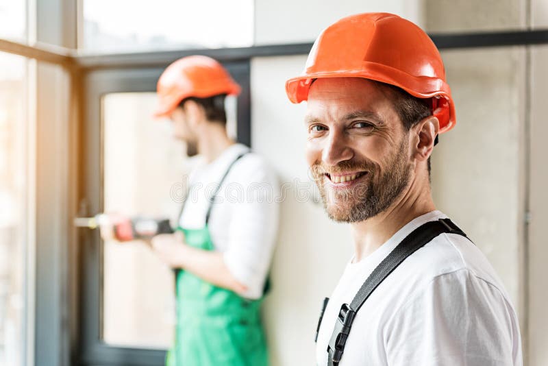 Hilarious Smiling Constructor in Apartment Stock Photo - Image of ...