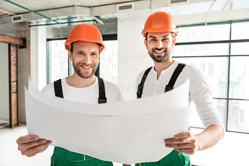 Hilarious Smiling Constructors Keeping Papers Stock Image - Image of ...