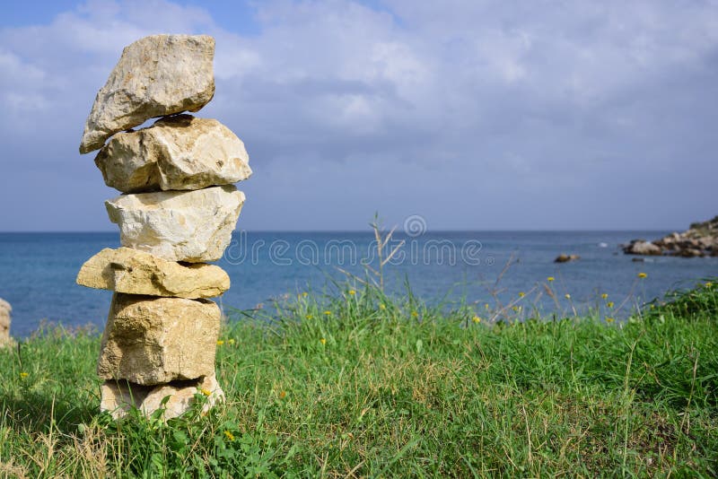 On a Hill on the Coast, Several Stones are Piled Up To Form a Tower and ...