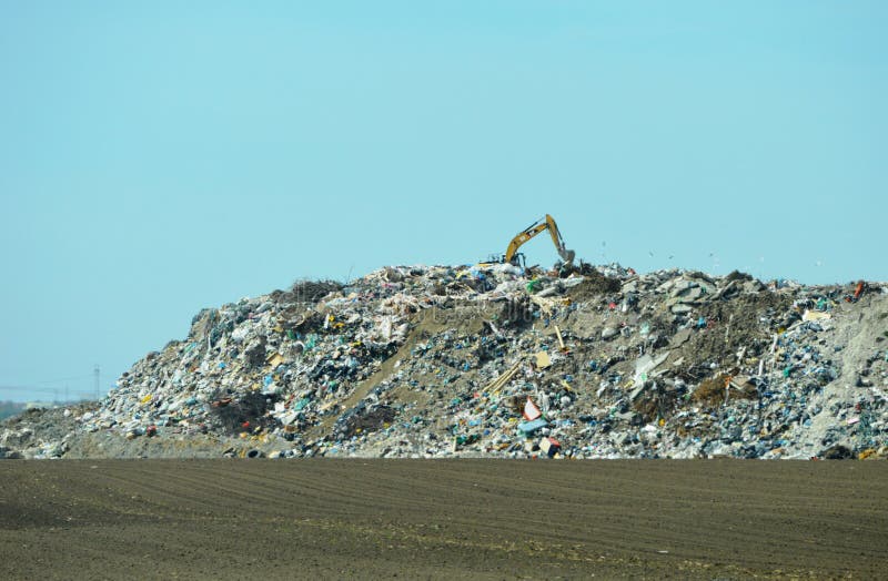 Hill of Garbage Next To a Field Stock Image - Image of color, landscape ...