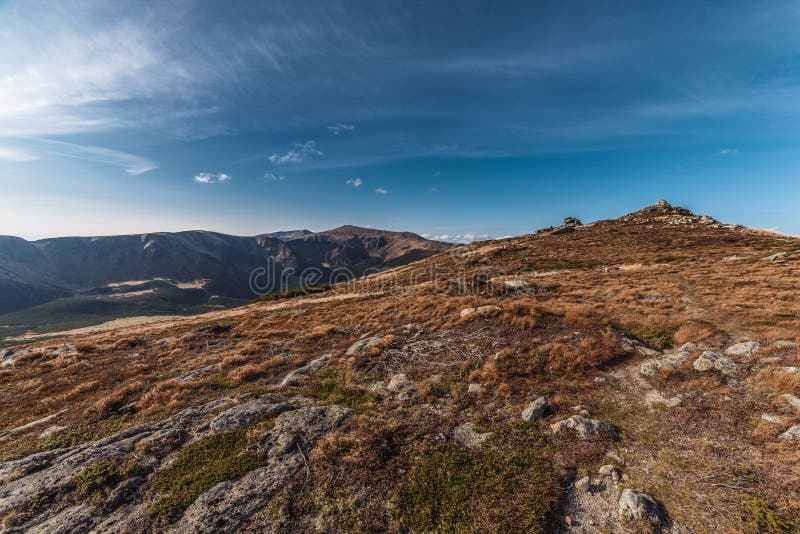 Hill with Red Grass and Rocks with Deep Blue Sky Stock Image - Image of ...