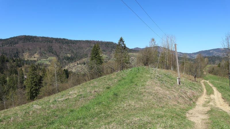 Hill in spring meadow stock photo. Image of blurred - 146920726