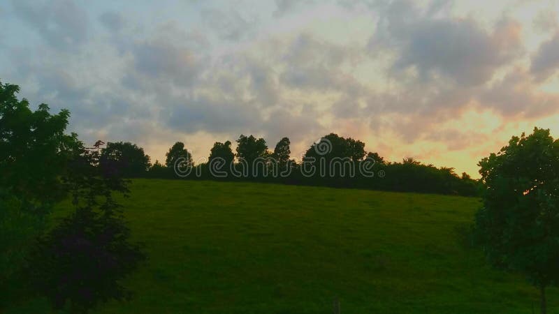 Hillside Sunset stock image. Image of tree, hillside - 151289279