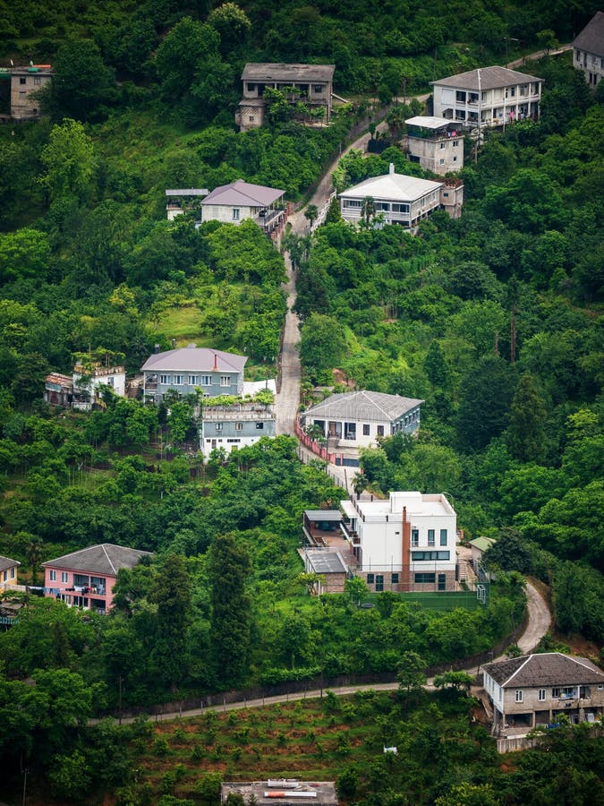 Hillside Village with Lush Greenery Stock Photo - Image of hillside ...