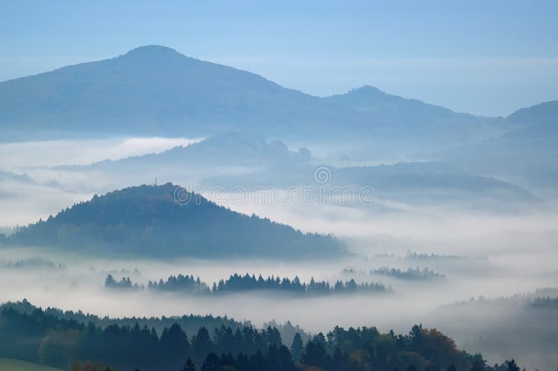 Hilly landscape with fog stock image. Image of scenic - 30376283