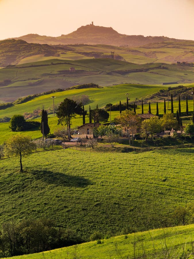 Hilly landscape at sunset stock image. Image of grassland - 149573393