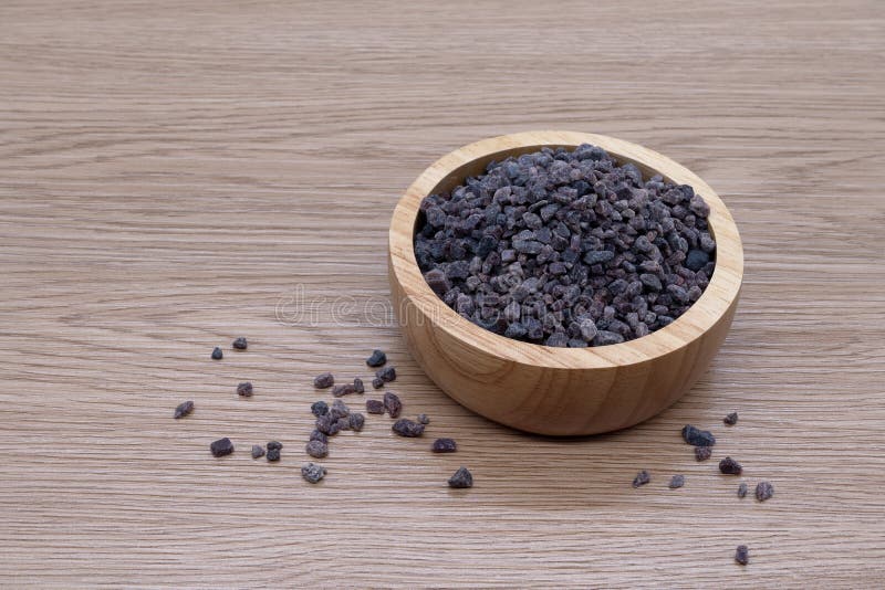 Himalayan Black Salt in Wooden Bucket on Stone Texture Background Stock ...
