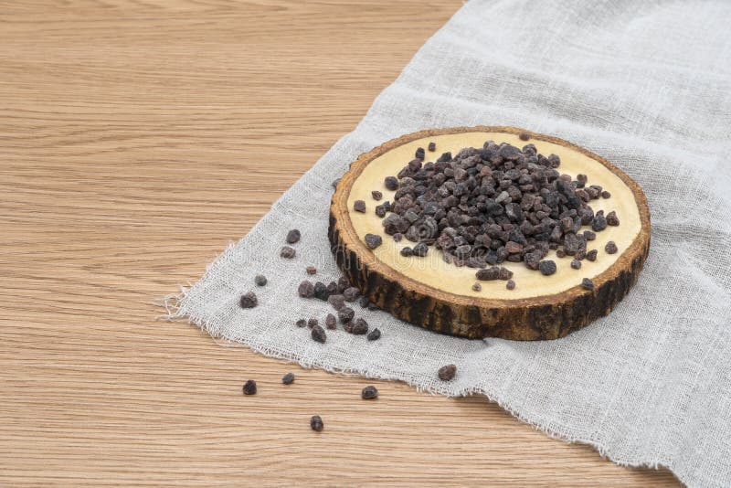 Himalayan Black Salt in Wooden Bucket on Stone Texture Background Stock ...