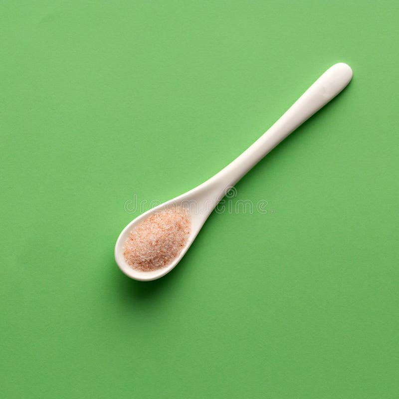 Himalayan Fine Pink Salt in Spoon - Green Background Stock Photo ...