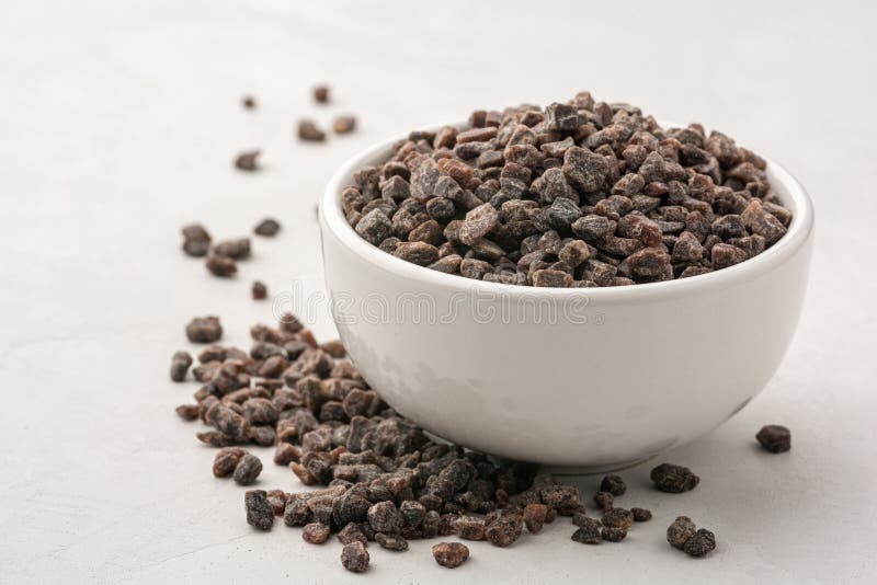 Himalayan or Indian Black Salt in Ceramic Bowl on Grey Concrete ...