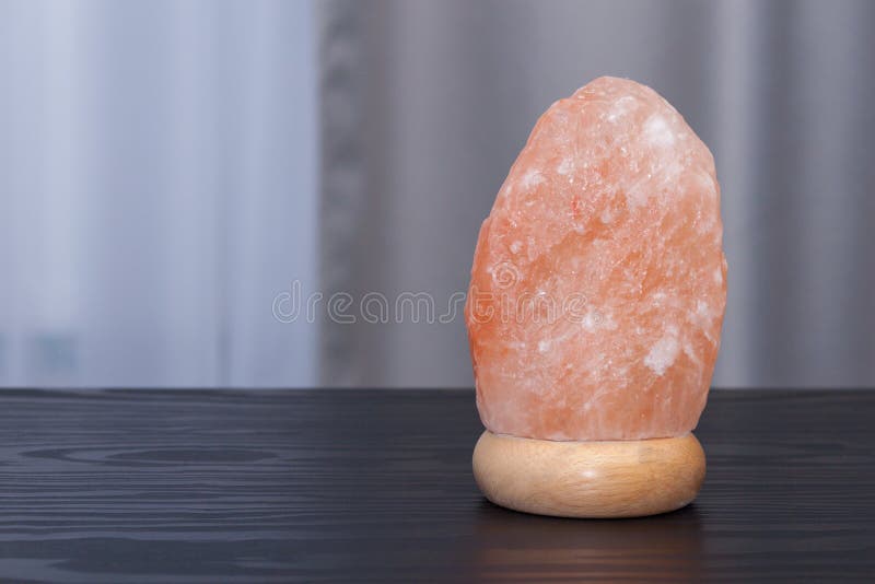 Himalayan Pink Salt Lamp on Table Indoors Stock Image - Image of ...