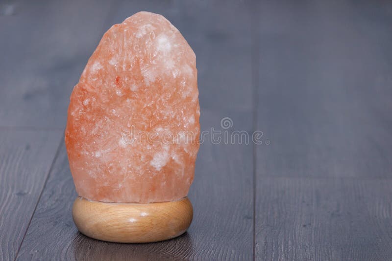 Himalayan Pink Salt Lamp on Table Indoors Stock Photo - Image of pink ...
