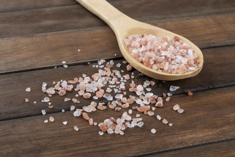 Himalayan Pink Salt on a Spoon Over Wooden Table Stock Image - Image of ...