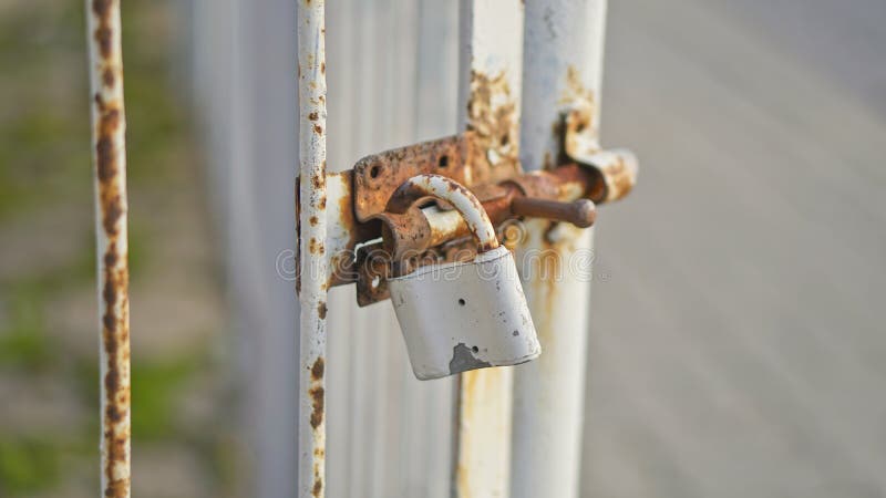 Old lock on a rusty gate stock image. Image of metal - 144218083