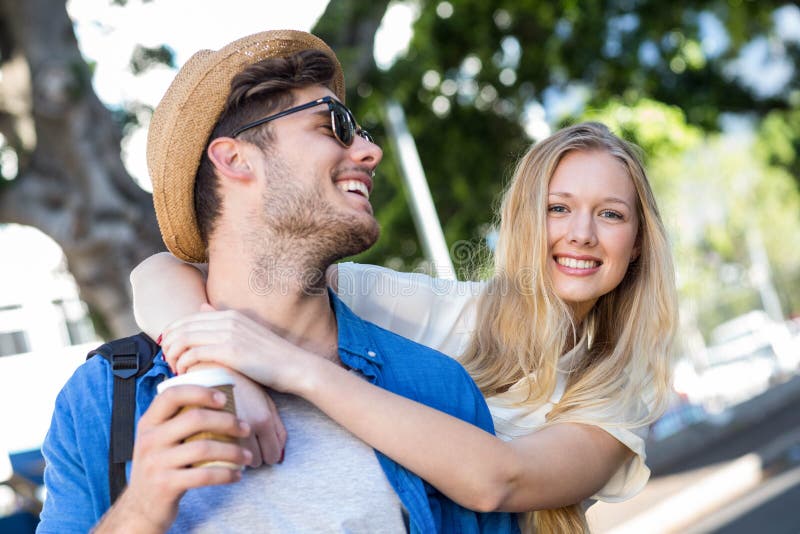 Hip Couple Embracing and Smiling Stock Photo - Image of holiday, couple ...