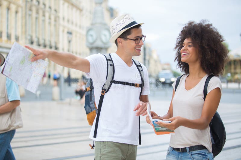 Hip Couple Holding Map and Laughing on Street Stock Image - Image of ...