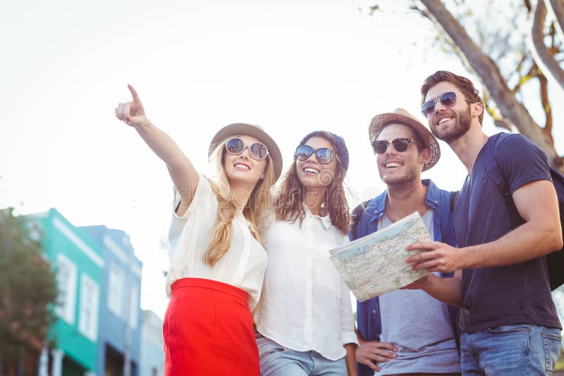 Hip Friends Checking at Map Stock Photo - Image of friendliness ...