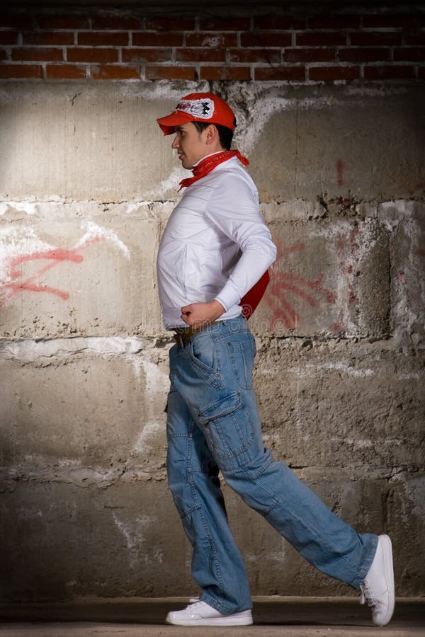 Hip Hop Boy Dancing in Modern Style Over Grey Wall Stock Photo - Image ...