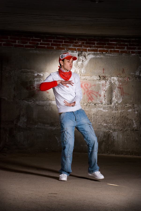 Hip Hop Boy Dancing in Modern Style Over Grey Wall Stock Photo - Image ...