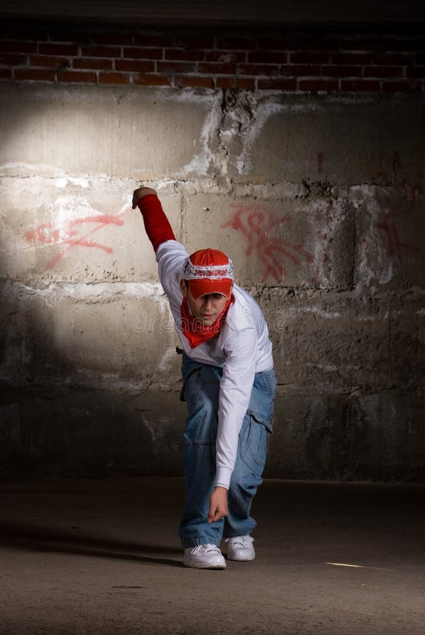 Hip Hop Boy Dancing in Modern Style Over Grey Wall Stock Photo - Image ...