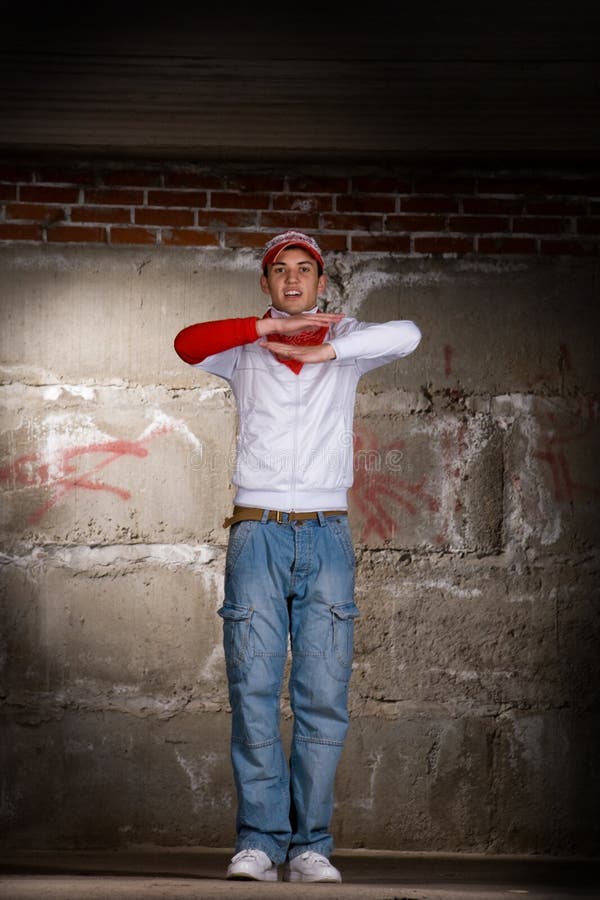 Hip Hop Boy Dancing in Modern Style Over Grey Wall Stock Image - Image ...