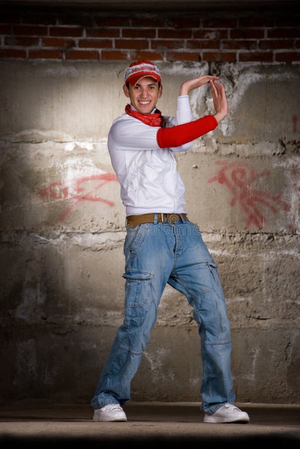Hip Hop Boy Dancing in Modern Style Over Grey Wall Stock Photo - Image ...