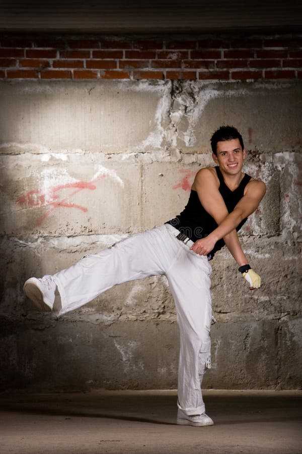 Hip Hop Boy Dancing in Modern Style Over Grey Wall Stock Image - Image ...