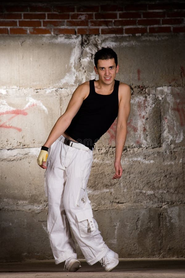 Hip Hop Boy Dancing in Modern Style Over Grey Wall Stock Photo - Image ...