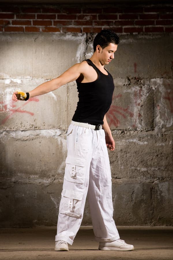 Hip Hop Boy Dancing in Modern Style Over Grey Wall Stock Photo - Image ...