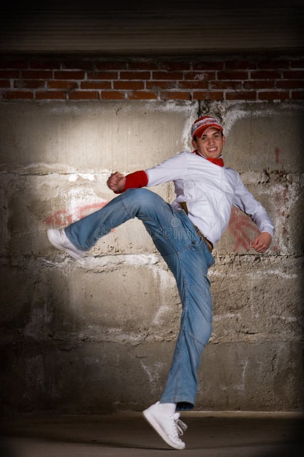 Hip Hop Boy Dancing in Modern Style Over Grey Wall Stock Photo - Image ...