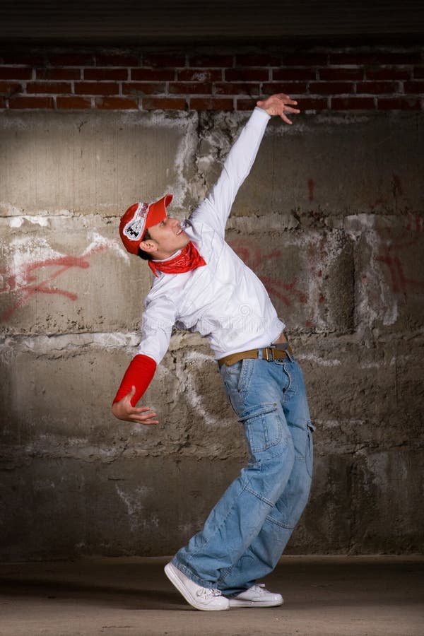 Hip Hop Boy Dancing in Modern Style Over Grey Wall Stock Image - Image ...