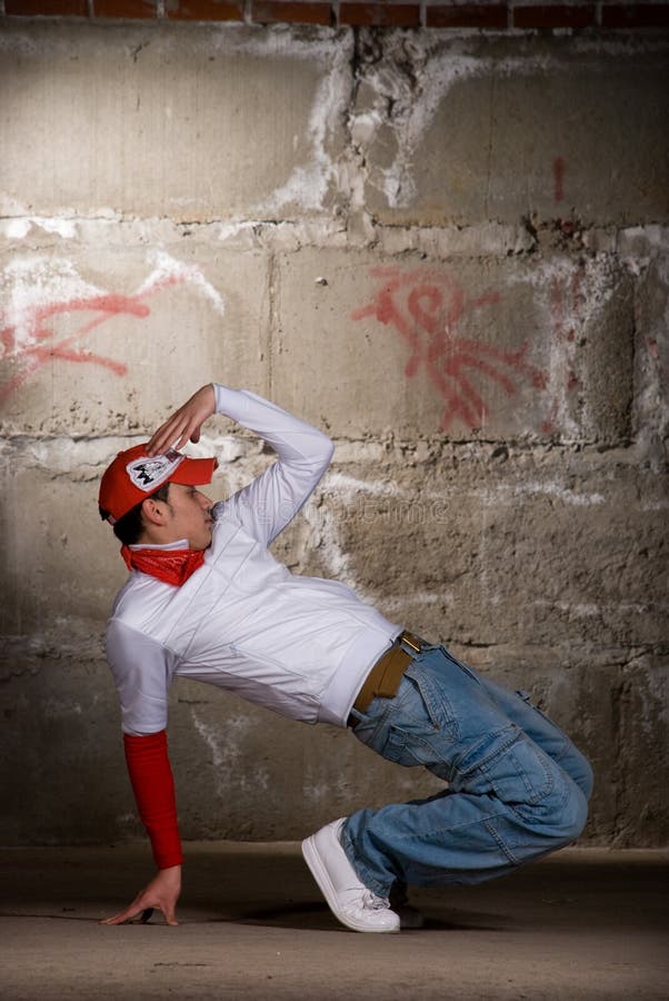 Hip Hop Boy Dancing in Modern Style Over Grey Wall Stock Photo - Image ...