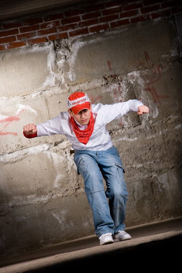 Hip Hop Boy Dancing in Modern Style Over Grey Wall Stock Photo - Image ...