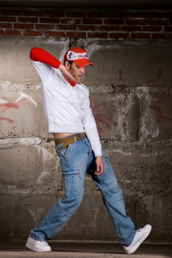 Hip Hop Boy Dancing in Modern Style Over Grey Wall Stock Image - Image ...