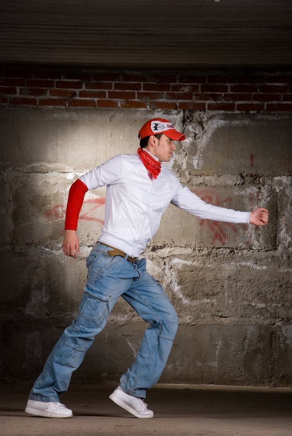 Hip Hop Boy Dancing in Modern Style Over Grey Wall Stock Photo - Image ...