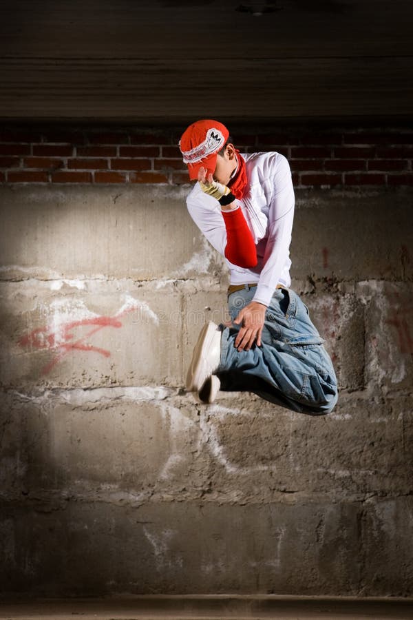 Hip Hop Boy Dancing in Modern Style Over Grey Wall Stock Photo - Image ...