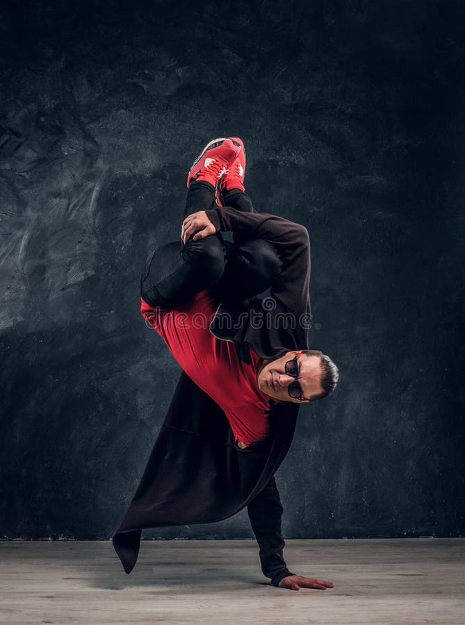 Hip-hop Style Dancer Performs Breakdance Acrobatic Elements. Stock ...