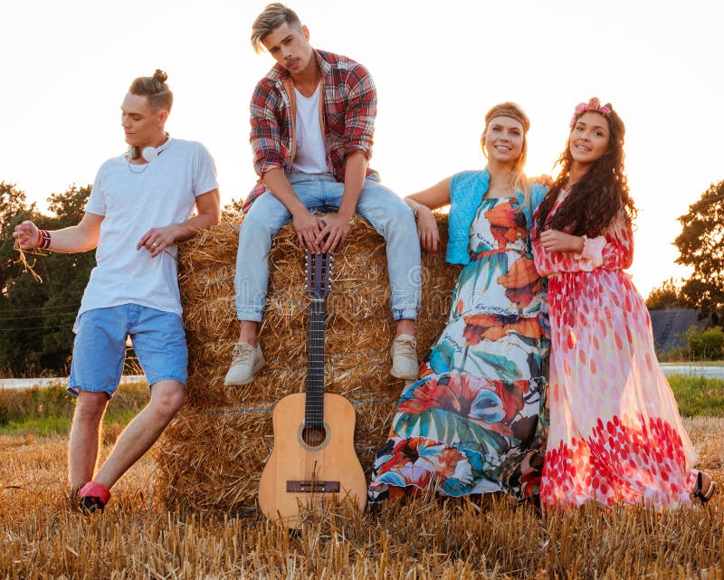 Hippie Friends with Guitar in a Wheat Field Stock Photo - Image of ...