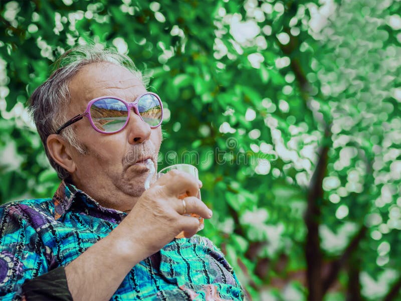 Hippie Old Man with a Glass of Alcohol Enjoying Life Stock Image ...